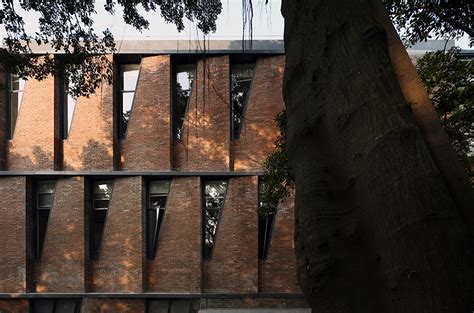 Red Brick Facade With Angular Windows Enfolds Multi Use Building In China
