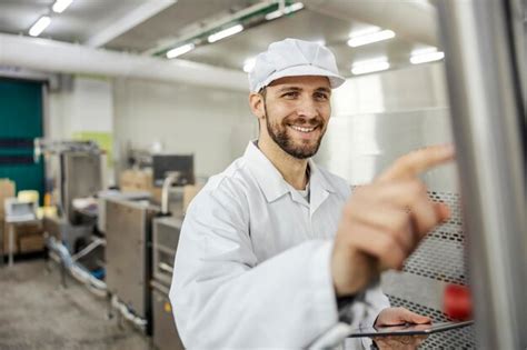Premium Photo A Meat Factory Supervisor Is Touching Display On A Meat