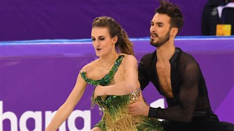 French Olympic Ice Dancer Endures Wardrobe Malfunction To Stay In Medal