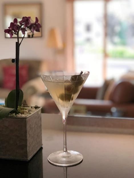 Premium Photo Close Up Of Martini Glass On Table