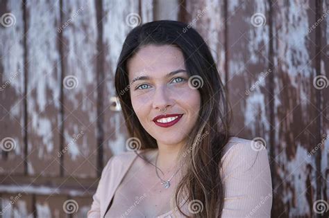 Portrait Of A Woman Young And Attractive Blue Eyes Calm And Smiling