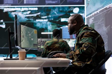 Premium Photo Army Staff In A Military Base Of Operations Oversees Intelligence Gathering