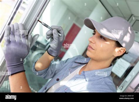 Woman Installing Rubber Seal In Window Stock Photo Alamy