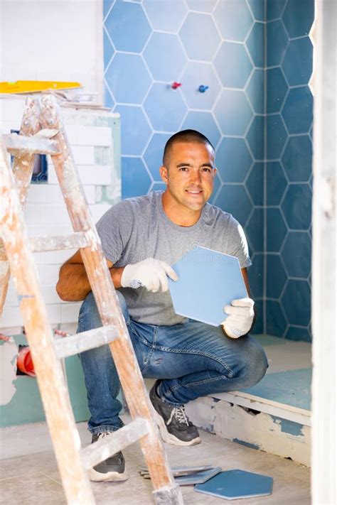 Cheerful Man Setting Tile In Bathroom Stock Photo Image Of Renewal Renovation 297082828