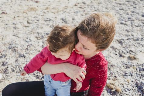 Premium Photo Mother And Daughter At Beach