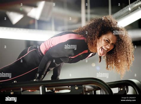 Strong Is My Motivation A Young Woman Doing Planche Pushups At The Gym