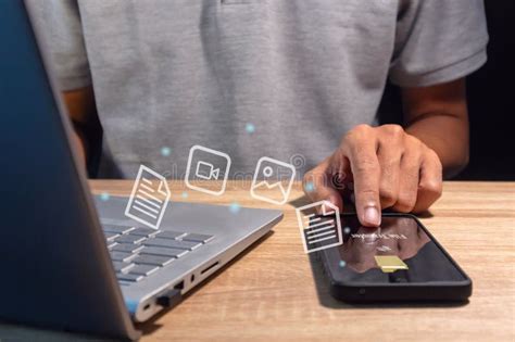 A Man Transfer Files Between Mobile Phone And Laptop Backup Copy File