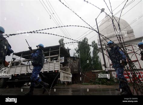 Indias Rapid Action Force Raf Personnel Hold Weapons During A Patrol