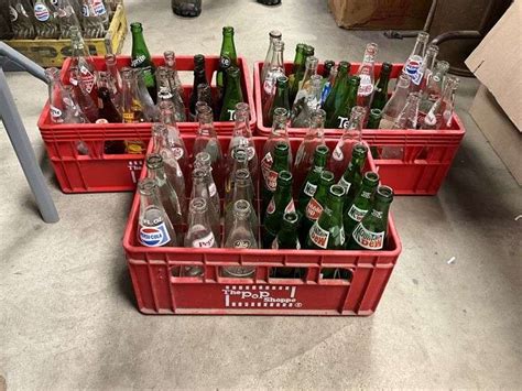 Assorted Vintage Bottles In Pop Shop Crates Legacy Auction Company
