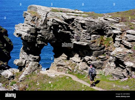 Man Walking On Path To The Natural Rock Arch Ladies Window Hole