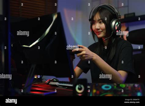 Female Cyber Hacker Gamer Using Controller Joystick To Playing Or