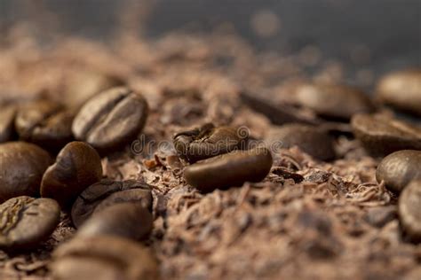 Roasted Coffee Beans Lie Together With Chocolate Crumbled Into Small