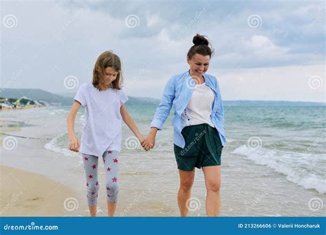 Mother And Preteen Daughter Reading Book Royalty Free Stock Image