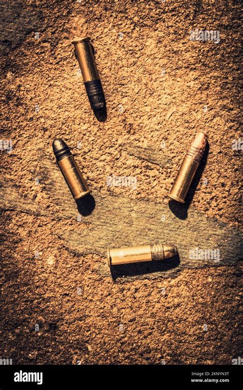 Old Fashioned Still Life Art On 22 Calibre Ammunition On Grungy