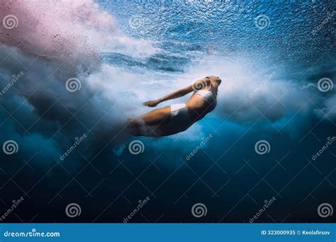 Surf Girl Dives Underwater With Ocean Wave Diving Under Barrel Waves