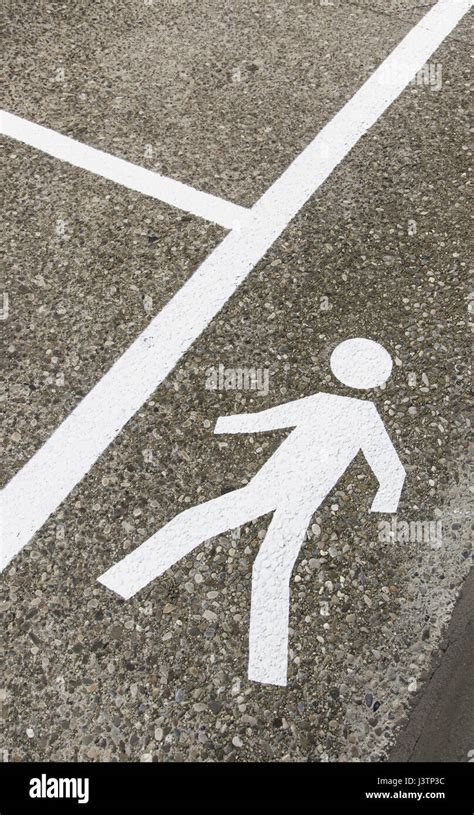 Pedestrian On The Asphalt Detail Of An Area For Pedestrian Use Information And Security Stock