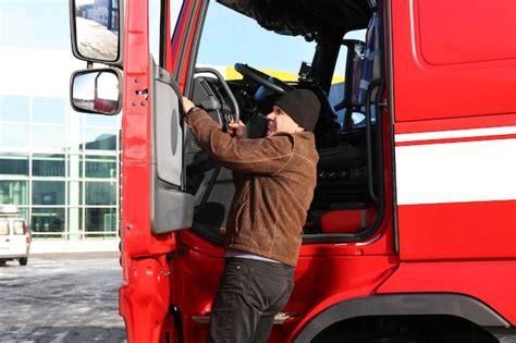 Premium Photo Driver Near Big Truck On Parking Lot