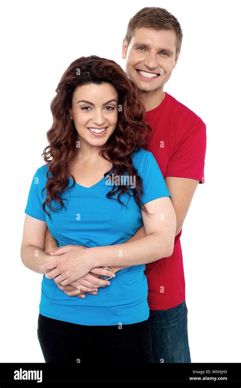 Handsome Young Man Hugging His Girl Friend From Back Holding Her Waist