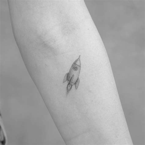 Single Needle Rocket Tattoo Located On The Inner