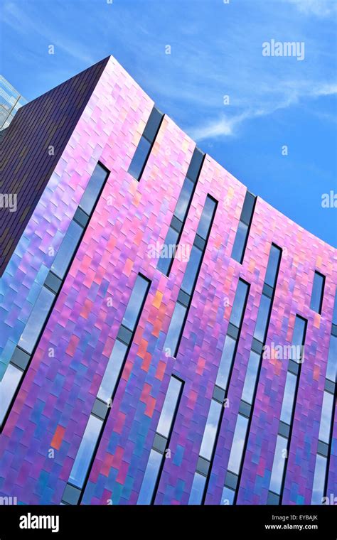 Abstract Pattern Of Colourful Cladding And Glazing Panels Reflecting Light From Bright Sky On