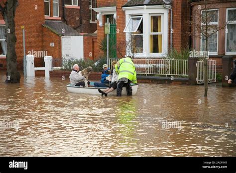 Evacuation Of Residents Carlisle Rescue Worker Evacuating Residents