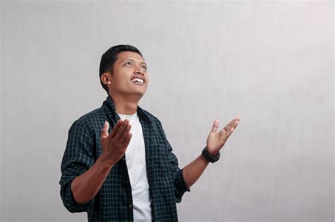 Premium Ai Image A Man With His Hands In The Air Looking Up And Smiling