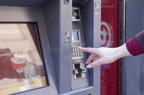 warsaw poland april 03 2025 close up of female hand entering pin on ticket machine keypad
