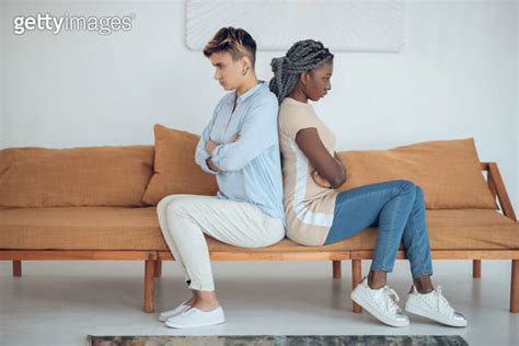 Same Sex Couple Having An Argument And Looking Distant And Cold 이미지