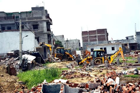 Bulldozers Remove The Illegal Constructions