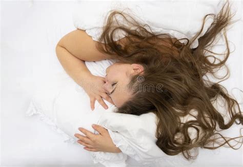 Top View Portrait Of Happy Positive Cheerful Fat Plump Sleeping Woman