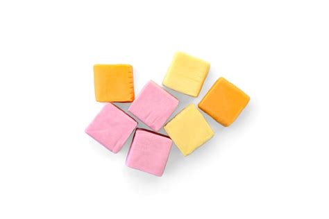 Premium Photo Pile Of Color Square Chewable Candies Isolated On White