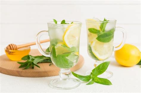 Premium Photo Mojito Cocktail Refreshing Mojito Cocktail With Lime Lemon And Mint In A Tall