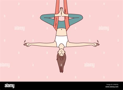 Woman Doing Aerial Yoga Hangs Upside Down In Hammock And Keeps Balance