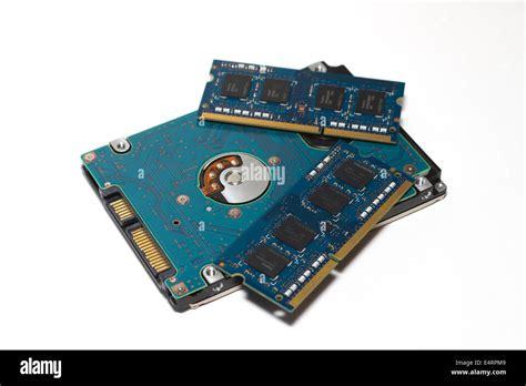 This Image Shows A Sata Hard Drive And Two Ram Memory Modules Isolated On A White Background