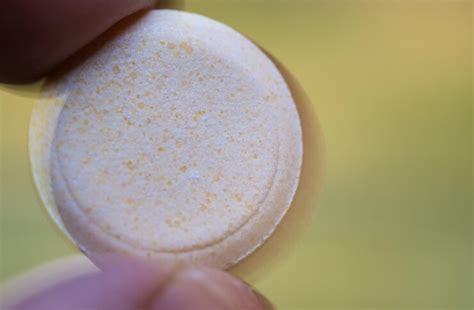 Premium Photo A Person Holds A Pill In Their Hands