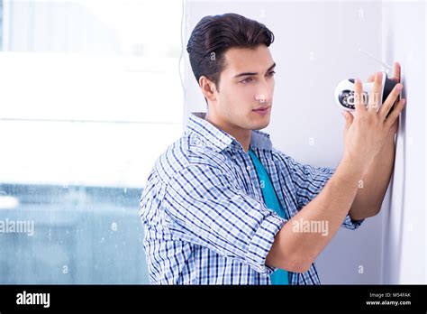 Man Installing Surveillance CCTV Cameras At Home Stock Photo Alamy