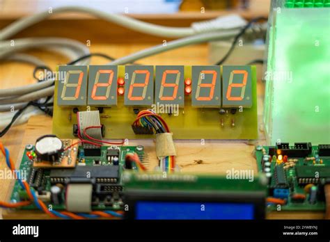Close Up Of The Inside Of A Digital Clock Circuit With A Dial Stock