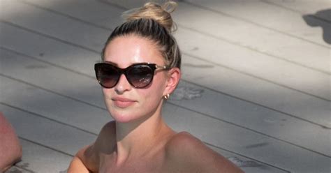 Zara Mcdermott Stuns In Orange Swimsuit After Pleading For Help On