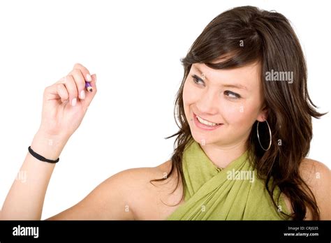 Young Woman Drawing Something On An Imaginary Glass Pane In Front Of