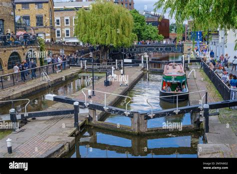 A Leisure Narrowboat Approaches The Lock Gate At Camden Lock On Regent