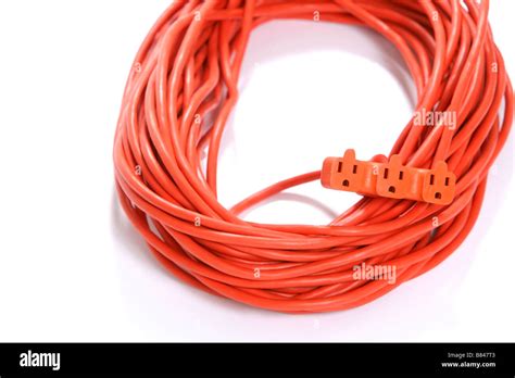 A Foot Orange Extension Cord Coiled Up With A Three Way Splitter Stock Photo Alamy