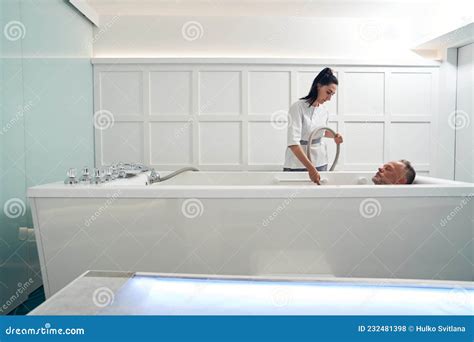 The Procedure Of Underwater Shower Massage In The Bathroomgirl On The