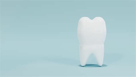 A White Tooth On A Light Blue Backgroundthreedimensional Illustration