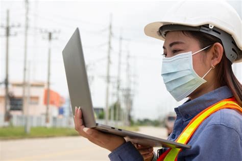 Premium Photo Female Engineer Holding Laptop Working Outdoor Worker Woman Use Computer Technology