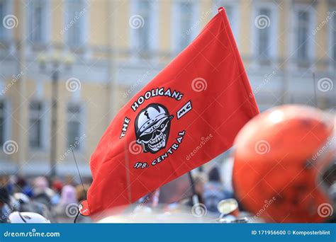 Red Flag Of The Hooligans Spb Central Mc Motorcycle Club On A Blurred Background On A Sunny Day