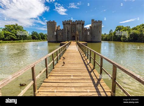 Medieval Bodiam Castle And Bridge Entrance Over The Defensive Moat In