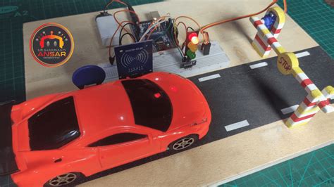 rfid based automatic vehicle barrier control ma robotic