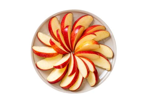 Red Apple Slices On White Plate