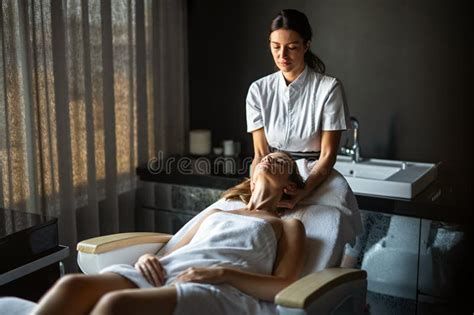 Young Happy Caucasian Woman Relaxing With Hand Massage At Beauty