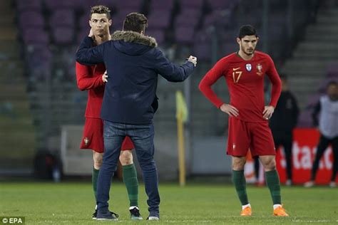 Cristiano Ronaldo Kissed By Excited Pitch Invader Daily Mail Online
